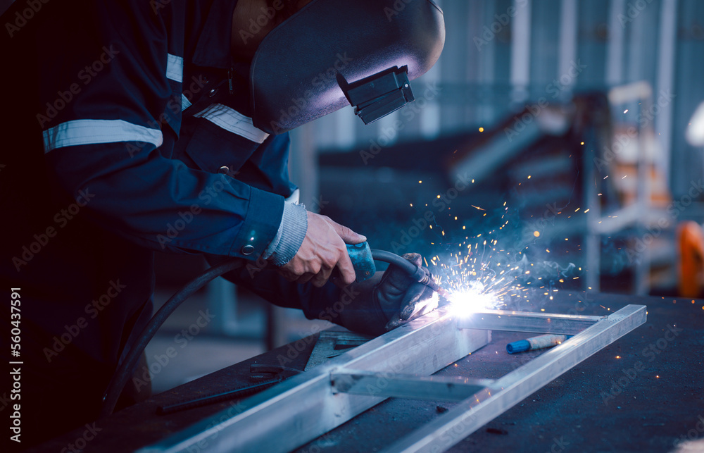 welder worker in his small workshop small industry skillful work ...