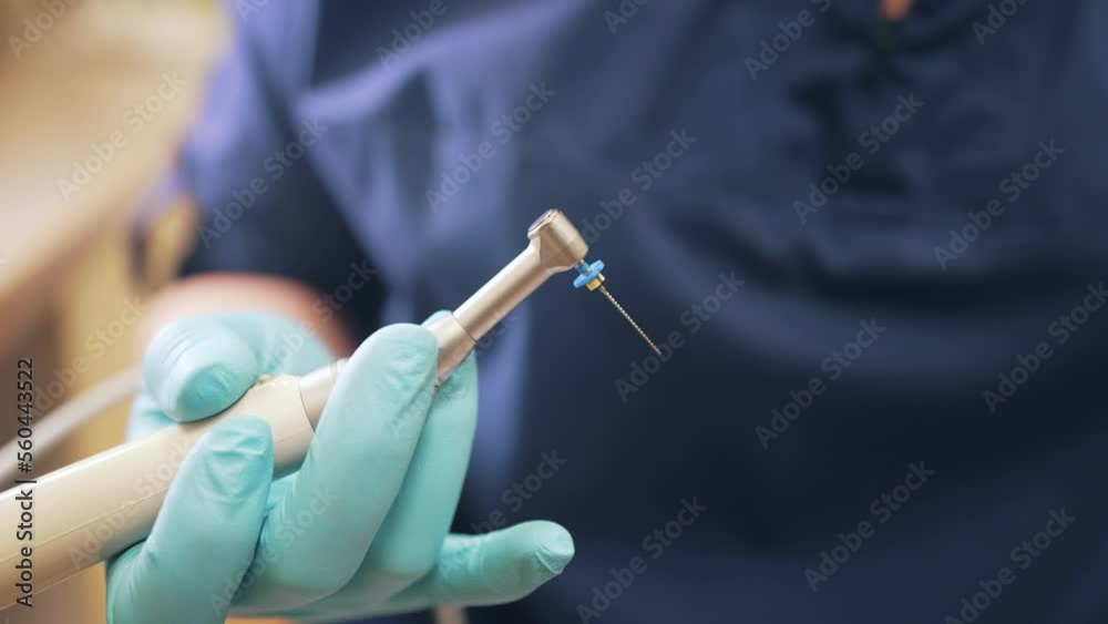 Dentist holds in hand dental wash tool with water and air in dental ...
