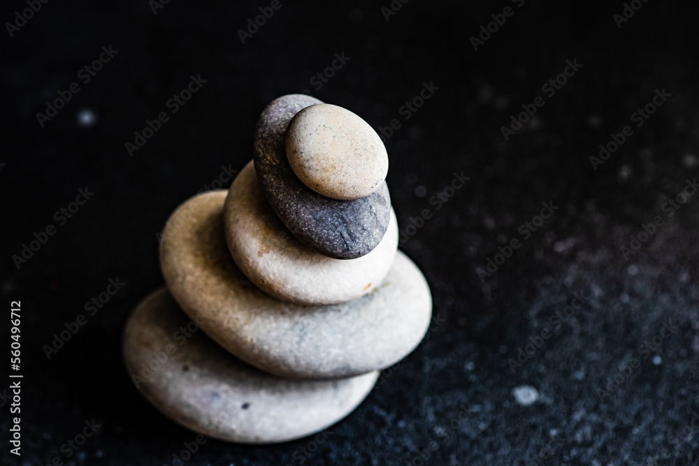 Overhead view of a stack of pebbles against a black background Stock ...