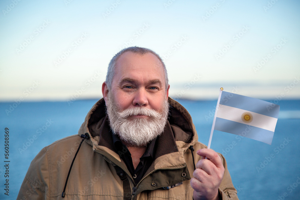Man holding Argentina flag. Portrait of older man with a national ...