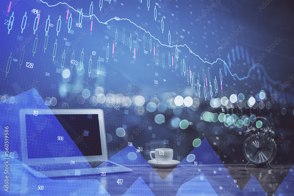 Financial chart drawing and table with computer on background. Multi ...