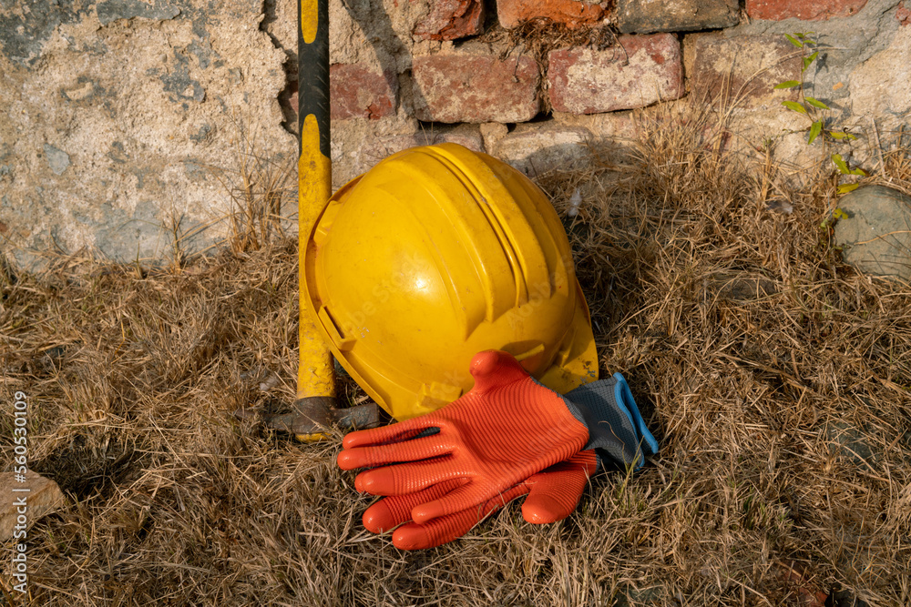 work on construction sites, individual protection of helmet, hammer and ...