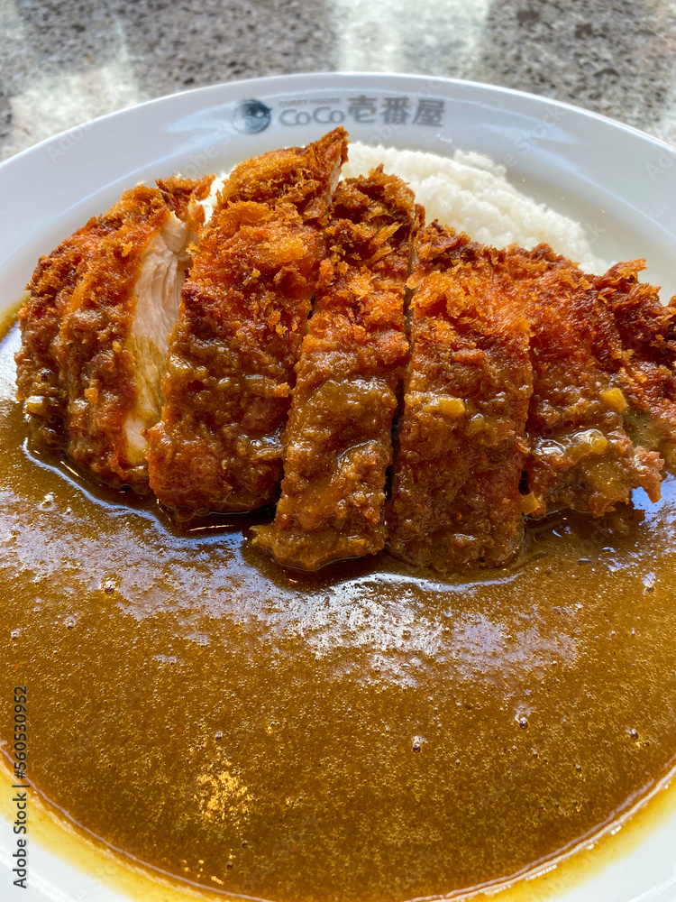 Coco Ichibanya restaurant. Plate of steaming curry with rice. Katsu ...