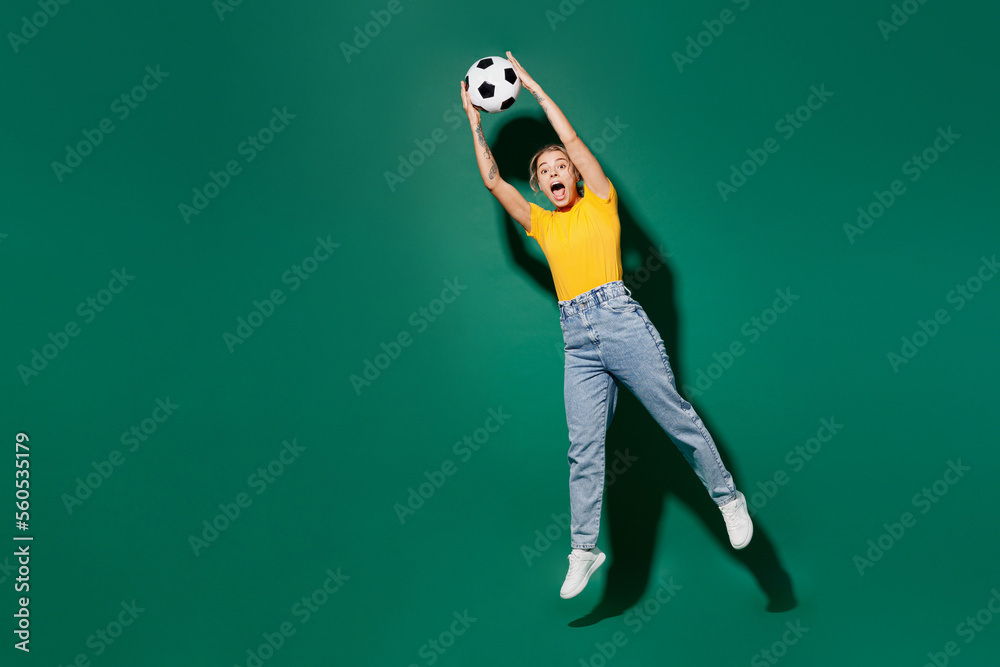 Full body young goalkeeper happy fun woman fan wearing basic yellow t ...
