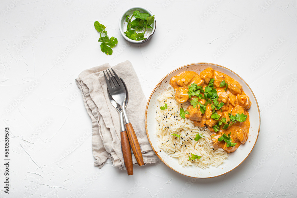 Traditional Indian dish chicken curry with basmati rice and fresh ...