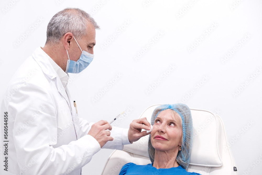 Horizontal picture of hand applying botox injection or acid hyaluronic ...