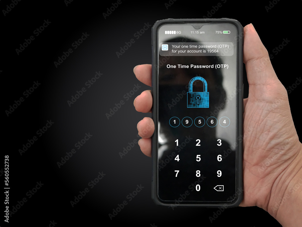 A hand holding a smartphone with filled up one time password for the ... A hand holding a smartphone with filled up one time password for the ...