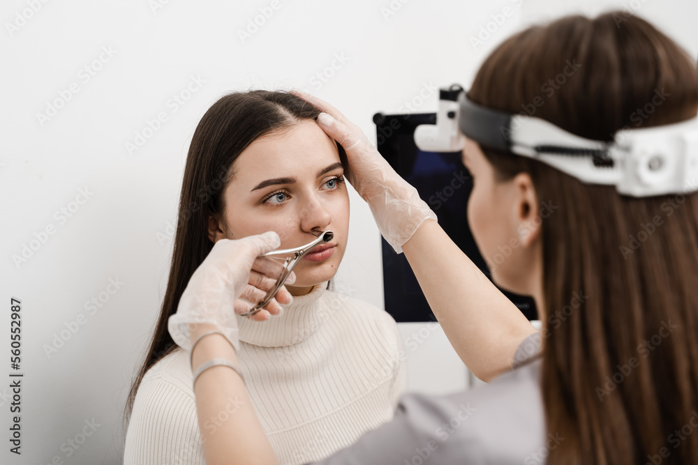 Rhinoscopy of woman nose. Consultation with ENT doctor ...