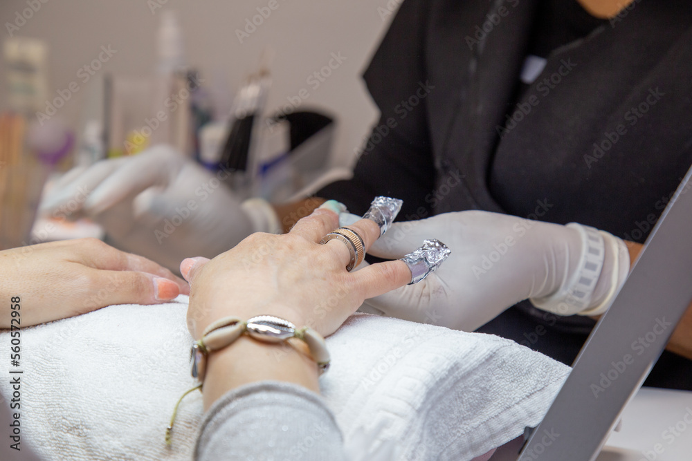 filing nails at the salon Stock Photo | Adobe Stock