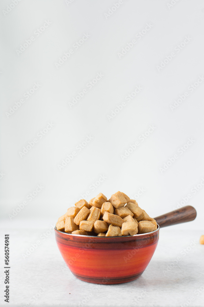 Nigerian Chin chin in an enamel bowl, Fried chin-chin snack in an ...