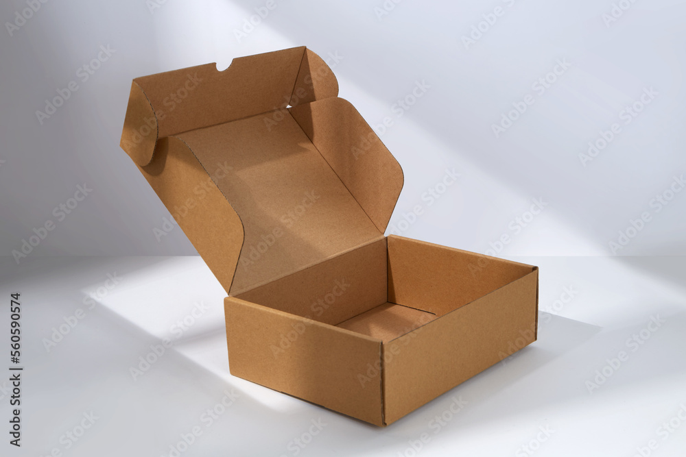 Empty cardboard Box with window shadow Stock Photo | Adobe Stock