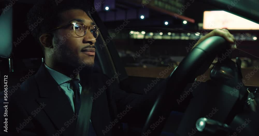 Portrait of A Handsome Black Man in a Suit Driving a Fancy Car at Night ...