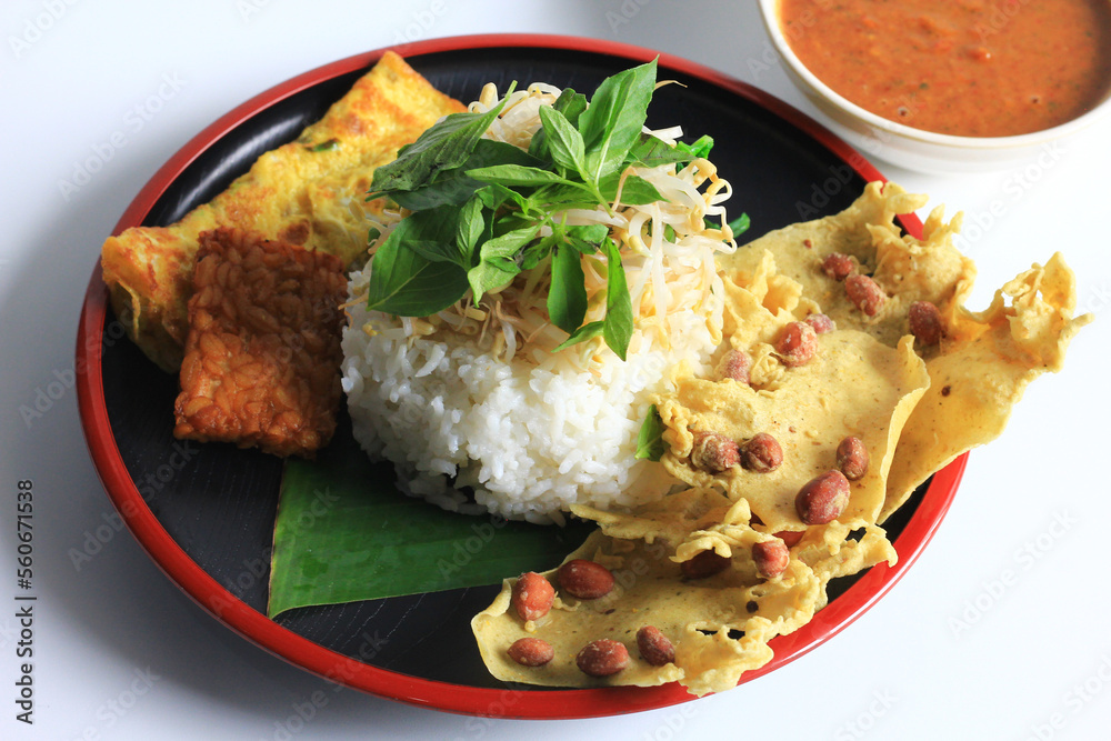 Nasi Pecel. Traditional Javanese rice dish of steamed rice with ...