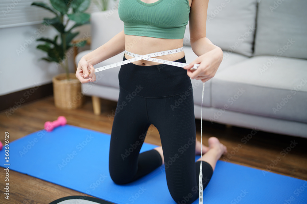 Asian woman with anorexia with measuring tape feeling unhappy. Anorexia ...