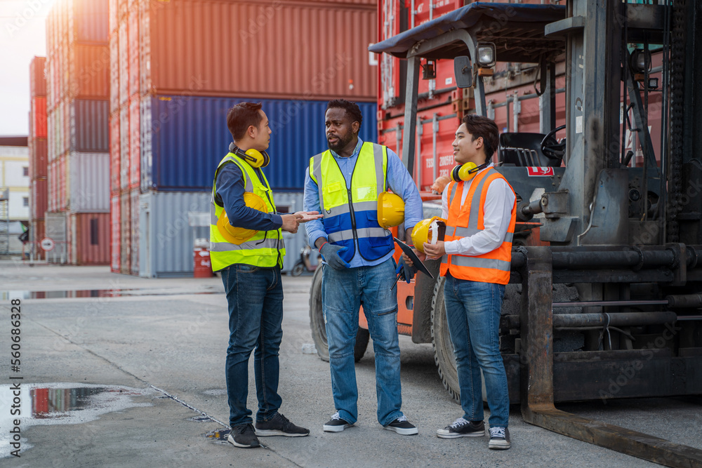 Engineer working and checking a quality of containers box from cargo ...
