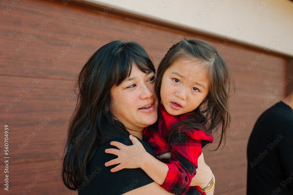 Mother hugging crying daughter Stock Photo | Adobe Stock