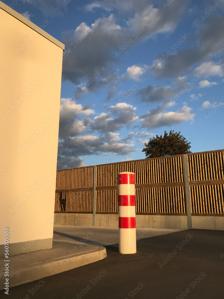 View of the red and white boundary post Stock Photo | Adobe Stock