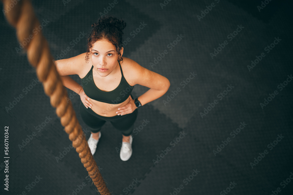 Rope climbing, gym and fitness woman with focus for sports challenge ...
