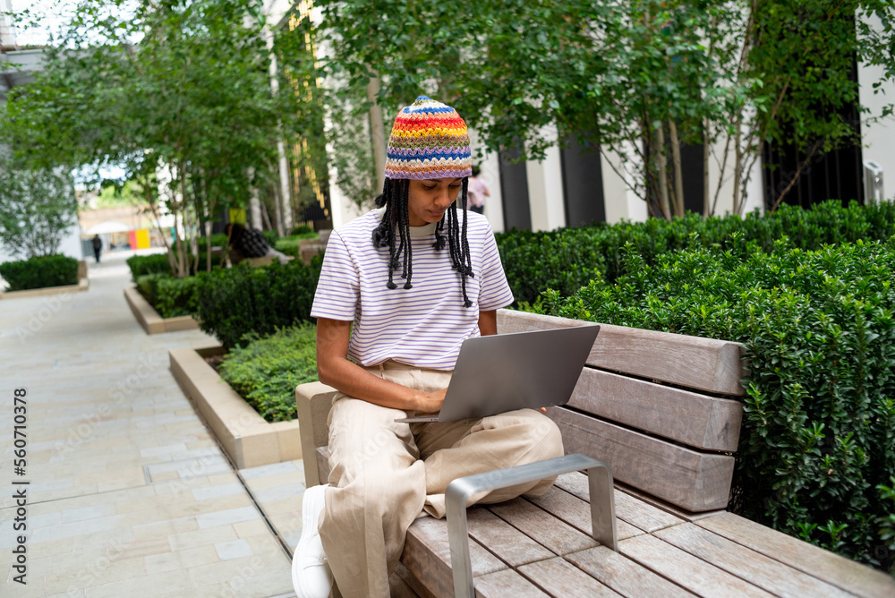 Young woman remote working on laptop Stock Photo | Adobe Stock