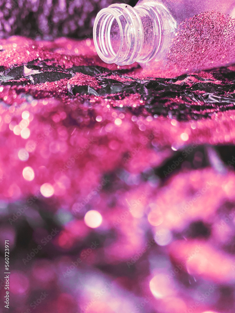 Purple glitter spilled from the bottle for the New Year's decoration ...