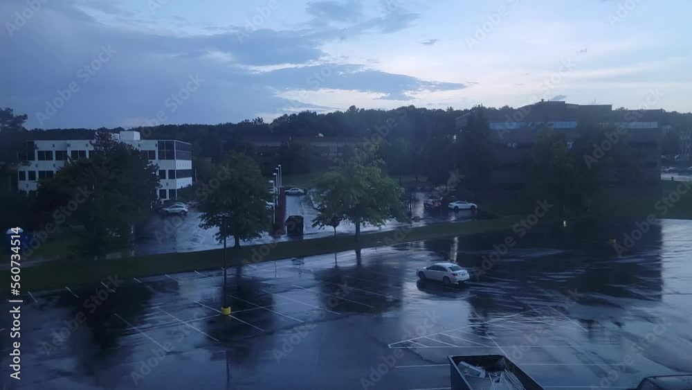 High angle shot over a parking lot outside the office building on a ...