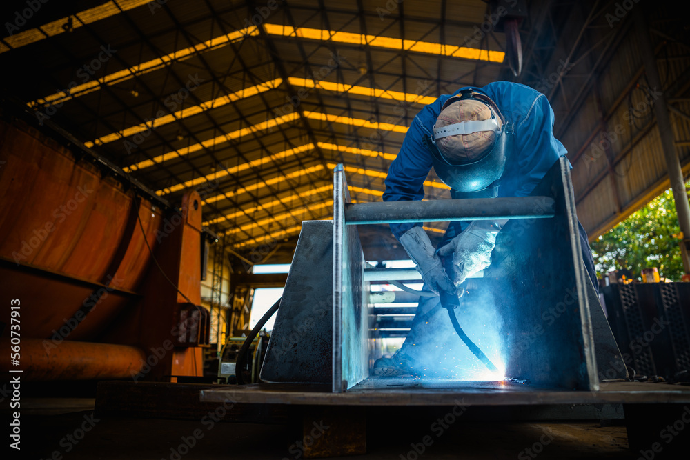 Industrial welder welding fabricated construction in factory, Welding ...