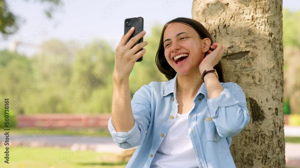 Happy Indian girl taking and clicking selfies and photographs of ...