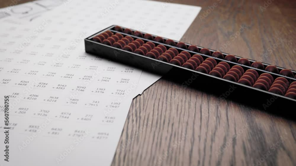 Japanese abacus soroban helping kids to learn mental math. It is placed ...