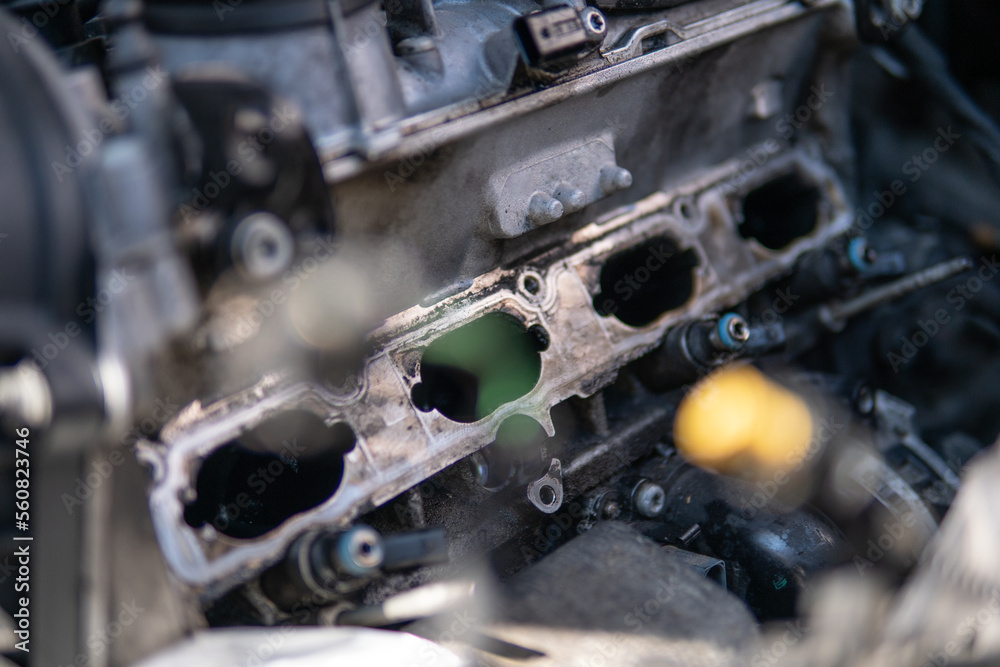 Close up of dirty intake manifold ports. Engine cleaning process the ...