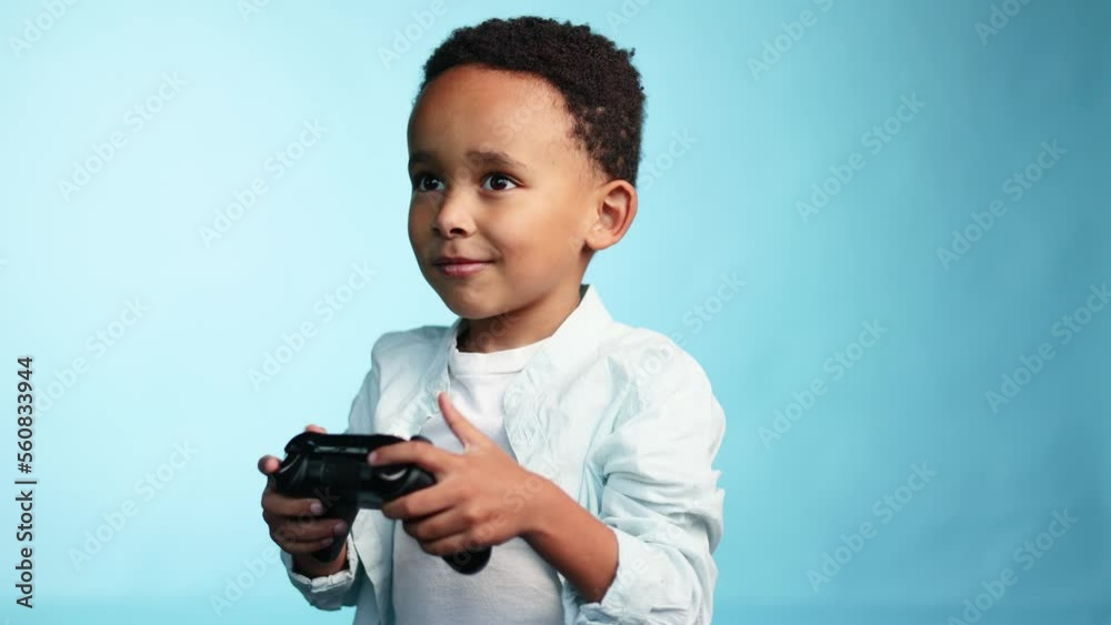 Excited cute little boy kid with joystick controller playing video ...
