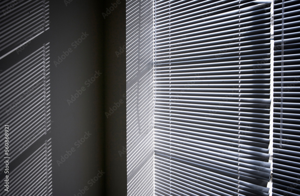 Light coming in through window blinds. Stock Photo | Adobe Stock