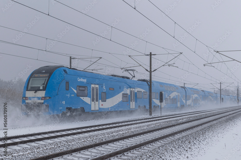 Bavaria, Germany, December 2022, go-ahead train drives through a winter ...