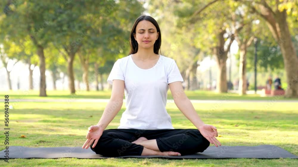Indian girl meditating Stock Video | Adobe Stock