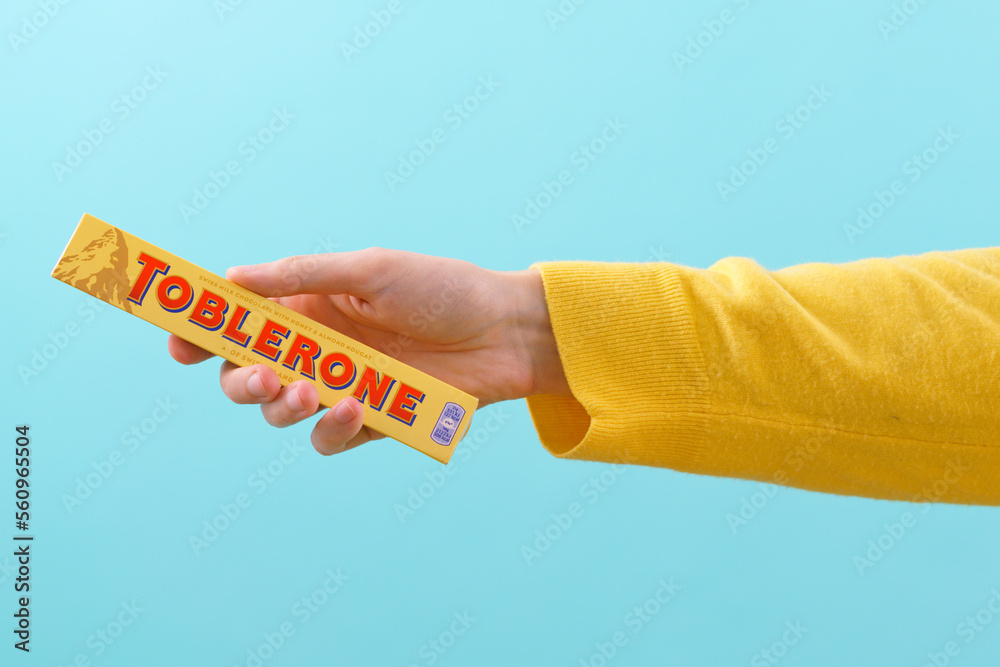 Zurich, Switzerland - Jan 12, 2023: A man's hand holds a Toblerone ...
