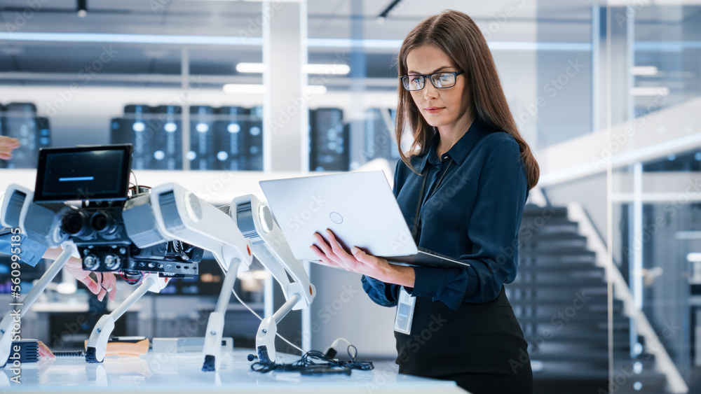Portrait of a Young Robotics Engineer Using Laptop Computer, Analyzing ...