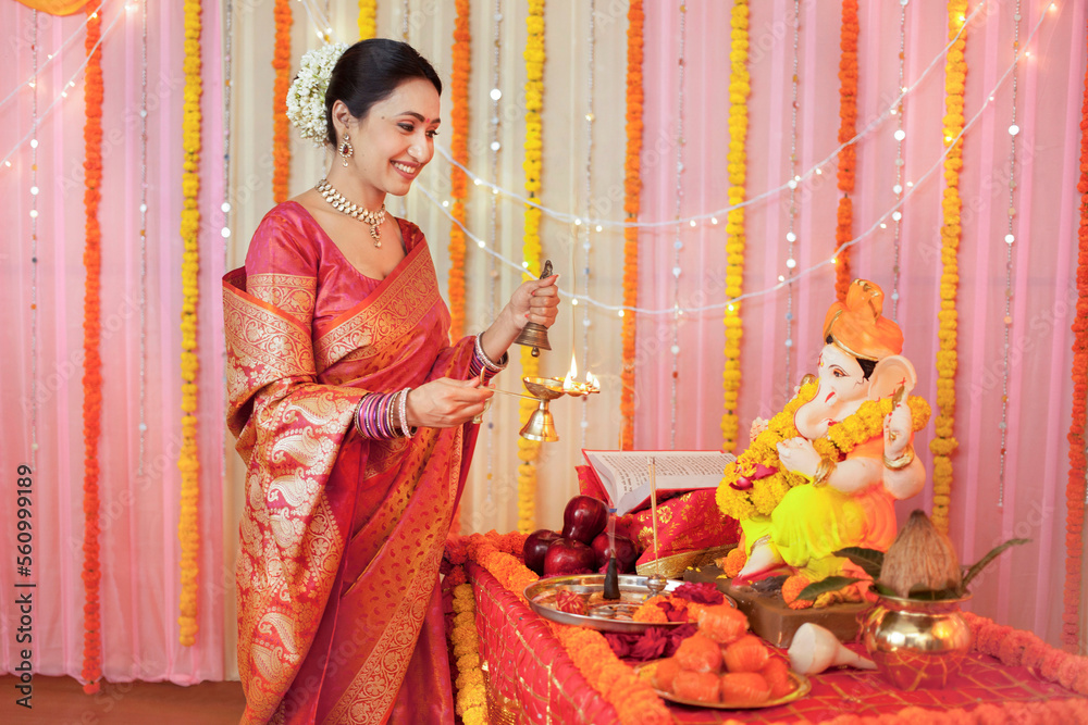 Indian woman offering aarti (pooja / puja) on Ganesh festival: Ganesh Chaturthi. Stock image of ...