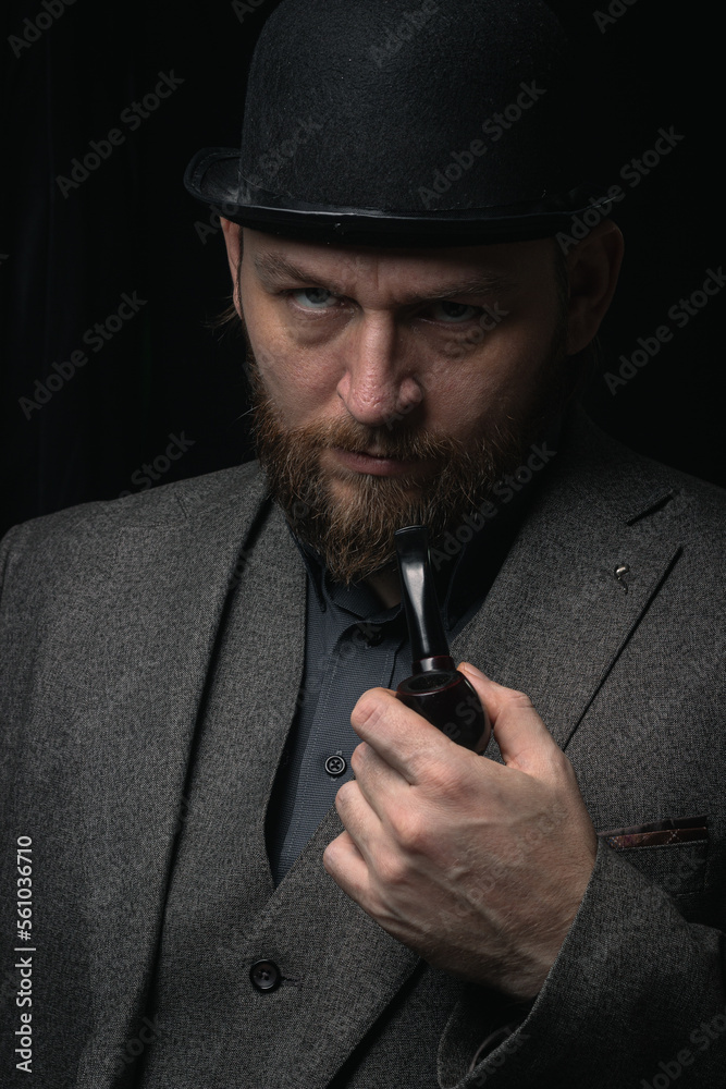 stylish man in retro outfit suit hat smoking wooden pipe sherlock holmes look cosplay england ...