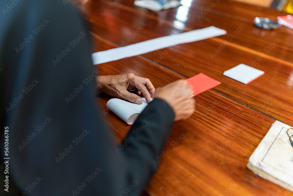 Calligraphy writing on red paper at Long Son Great House, Ong Tran ...