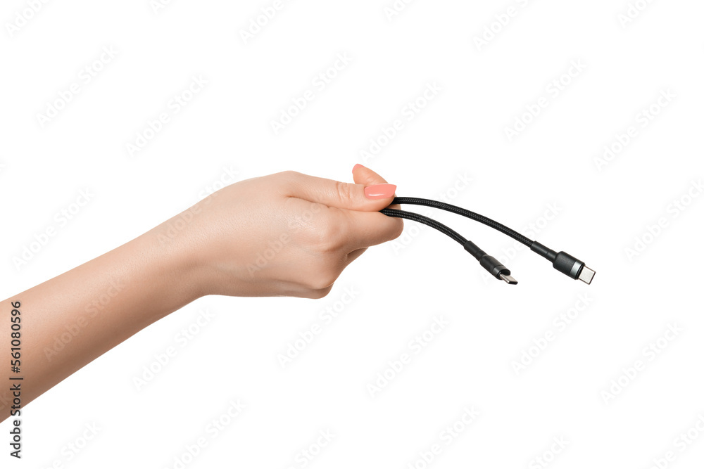 Type C charging wire in a male hand on a white background, isolate ...