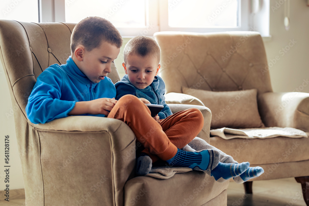 Happy children playing video games Stock Photo | Adobe Stock