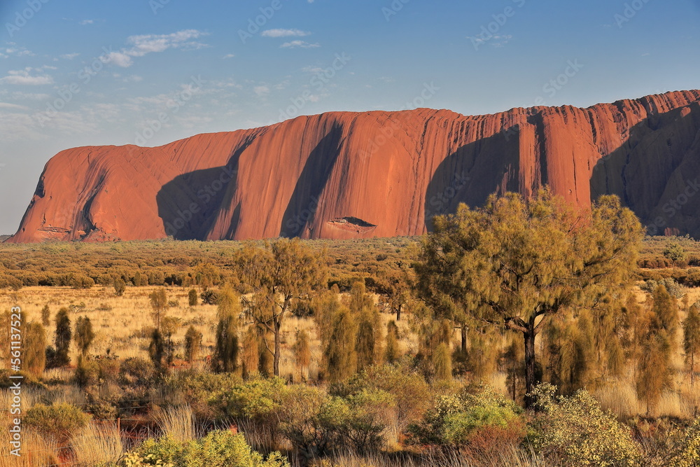 Early morning partial view of Uluru-Ayers Rock under an almost clear ...