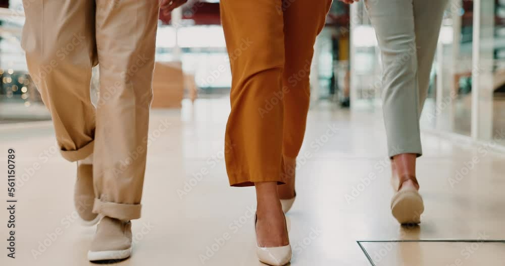 Office, shoes and group of business people walking together to a ...