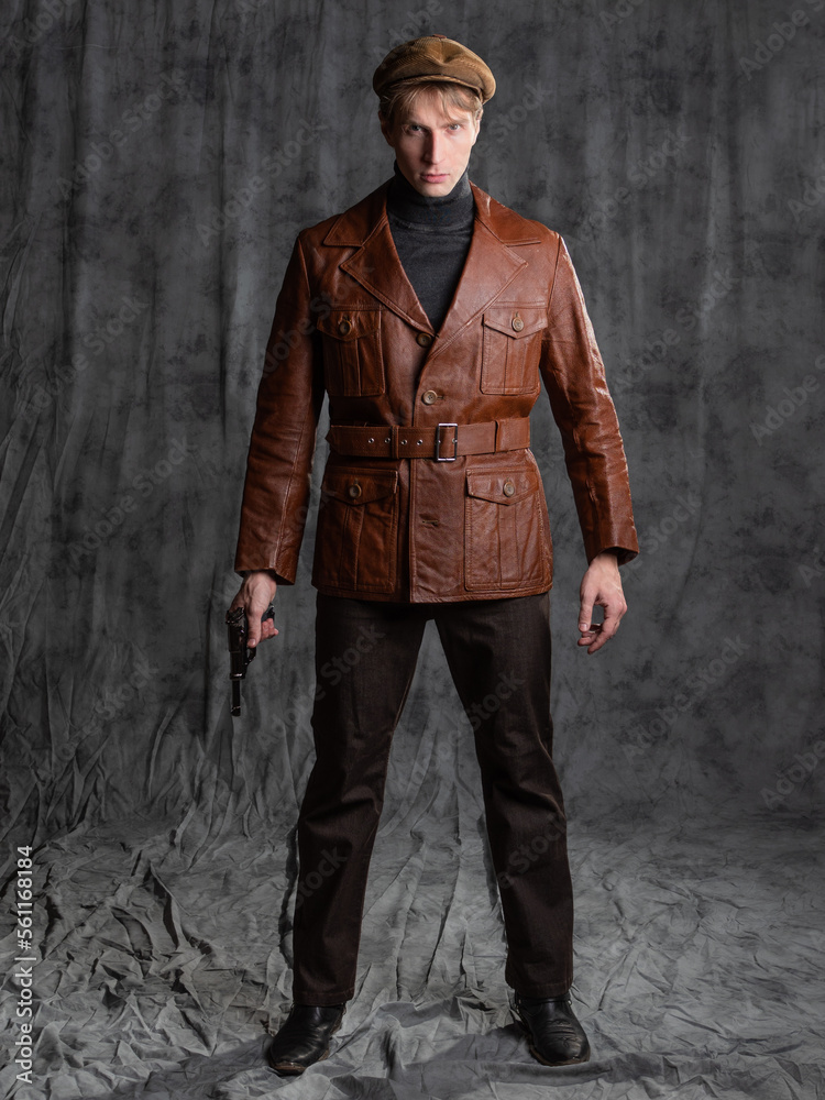 young man, a retro secret agent, a guy in a brown leather jacket and a ...