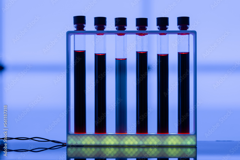 samples of radioactive liquid in test tubes in a nuclear physics ...