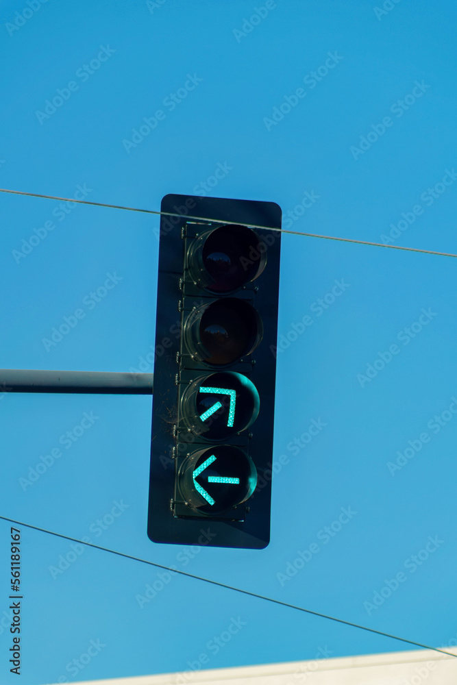 Double green traffic light to signal to drive through for a car or bus ...