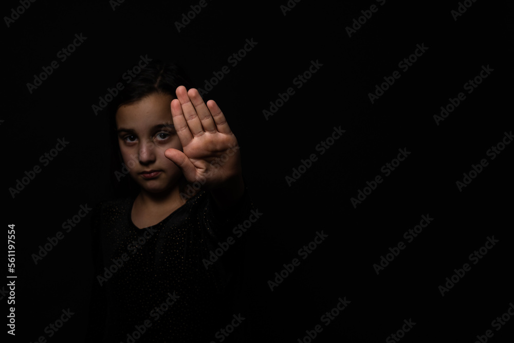 Kid girl showing hand signaling to stop useful to campaign against ...