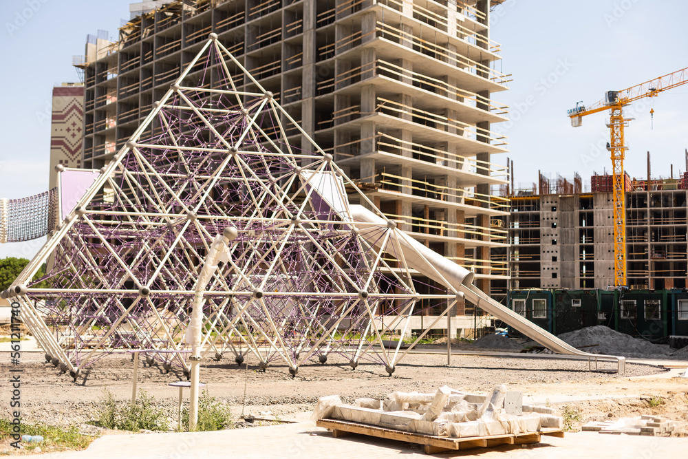 Construction site background. Hoisting cranes and new multi-storey ...