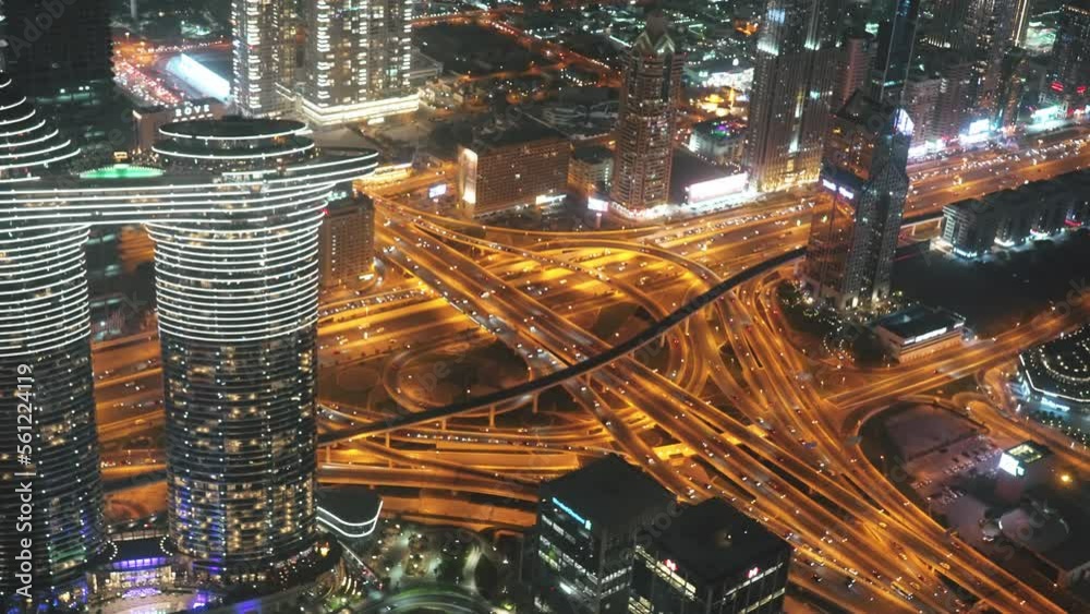 Multi-level illuminated road Burj Khalifa from bird eye view at night ...