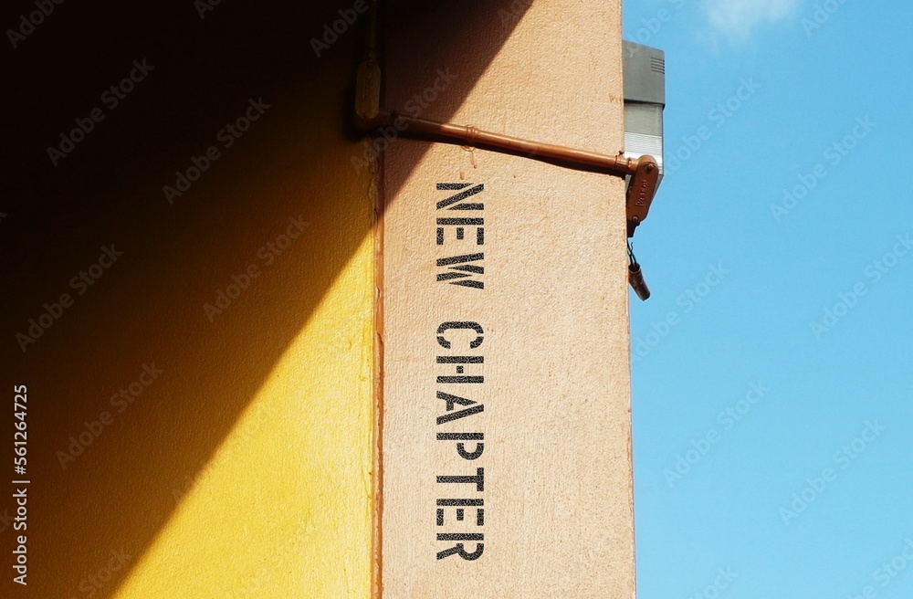 Building with inscription NEW CHAPTER ,concept of reinvent yourself and ...