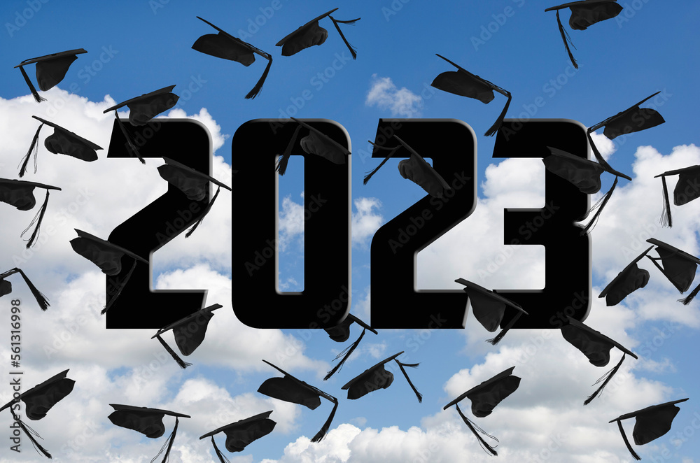 Black graduation caps airborne in the sky with black 2023 text Stock ...